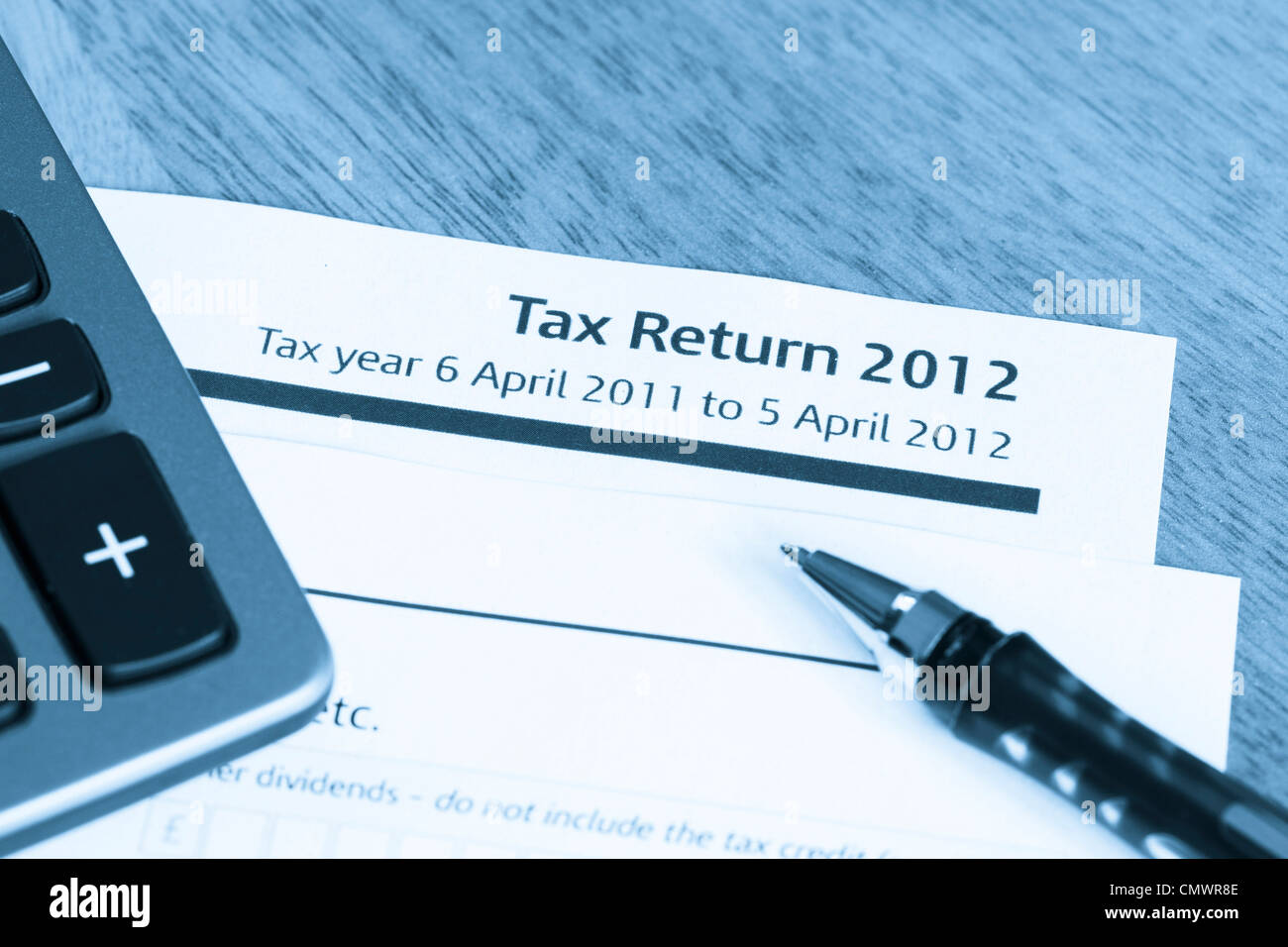 Cool toned image of UK income tax return form for 2012 Stock Photo - Alamy