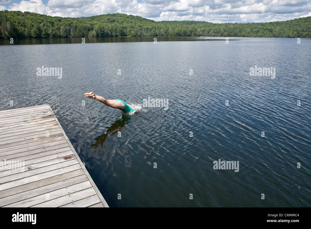 Woman diving, Smoke Lake, Algonquin Park, Ontario Stock Photo - Alamy