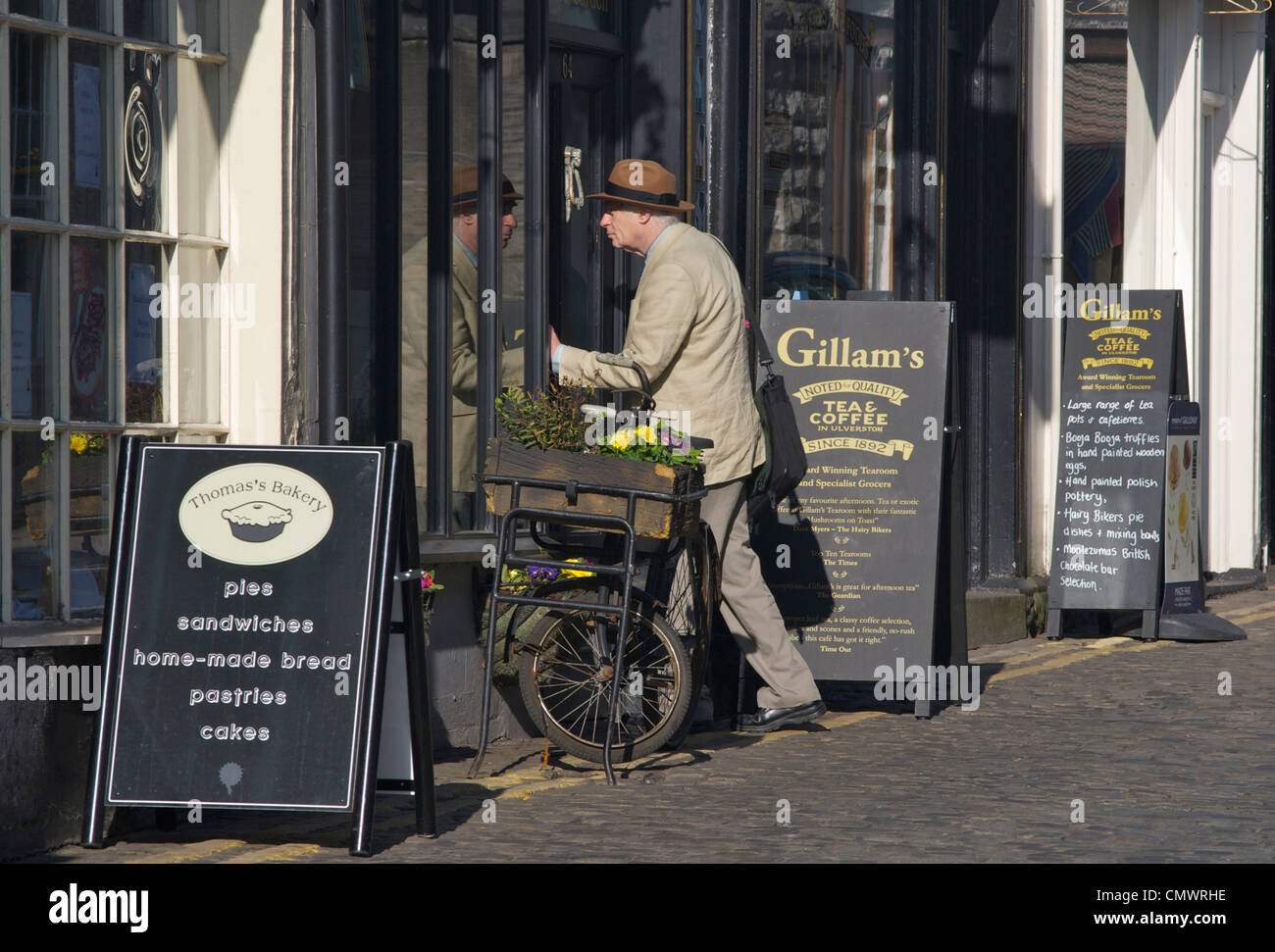 Man walking by cafe hi-res stock photography and images - Alamy