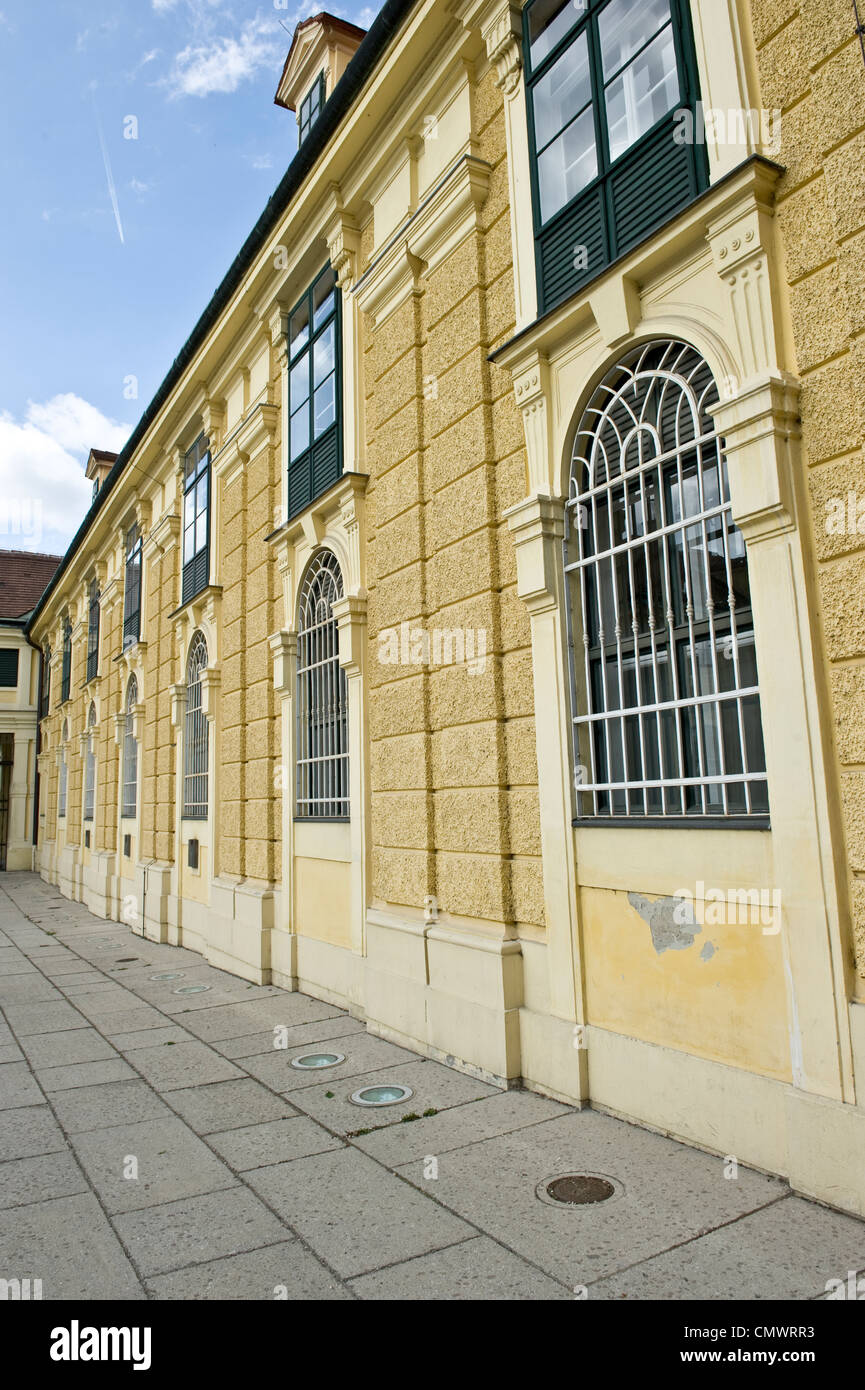 Wide side view of a yellow building Stock Photo - Alamy
