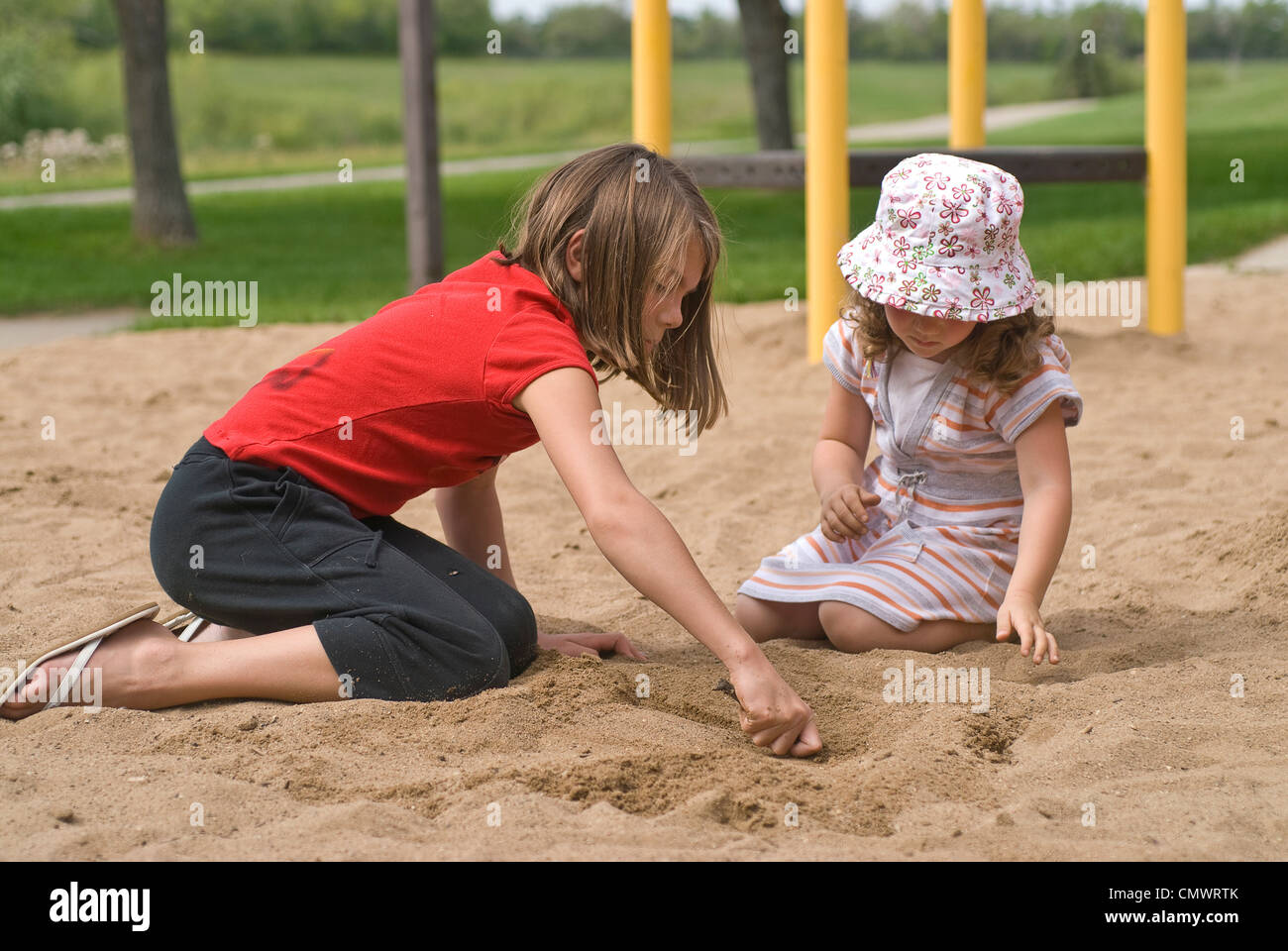 Girls playing in sand at park, Wascana View, Regina, Saskatchewan Stock ...