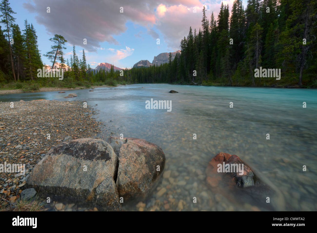 Evening on crystal clear Mistaya River, Banff National Park, Alberta ...