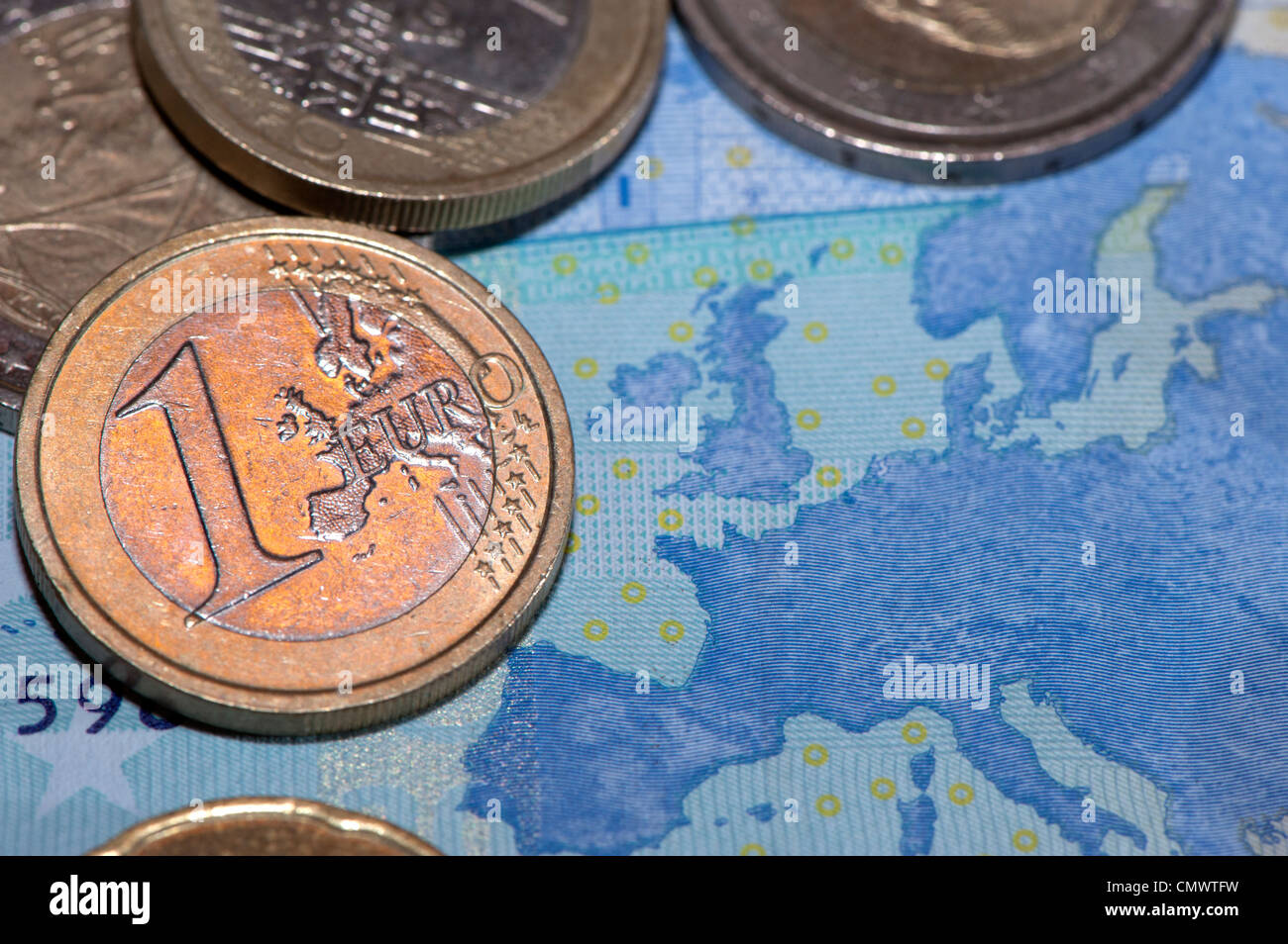 Euro currency, showing bank notes and coins, and the UK on a Euro note ...