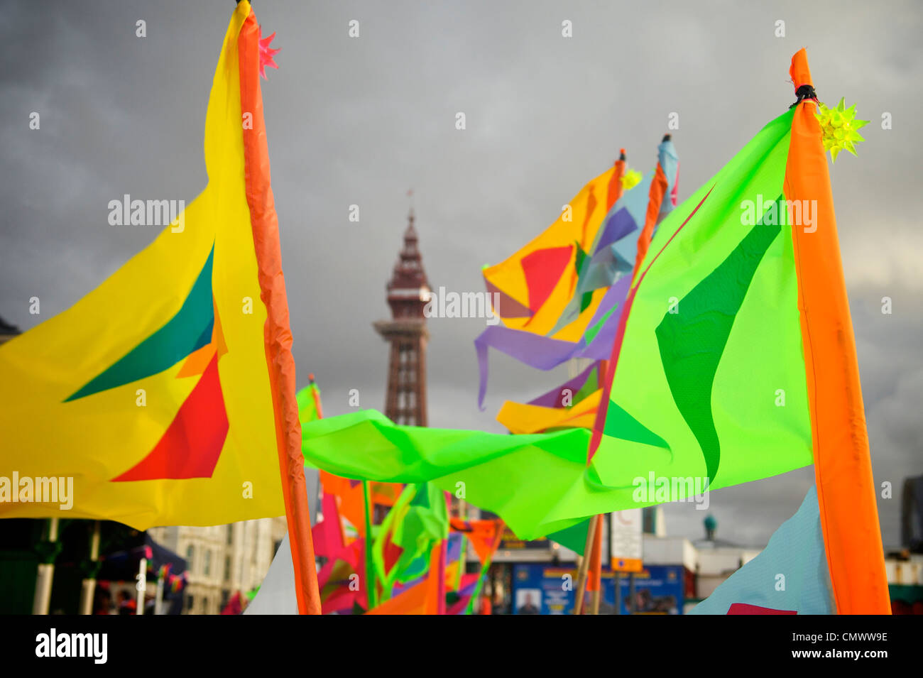 Colourful flags fluttering in the breeze with Blackpool Tower in the ...