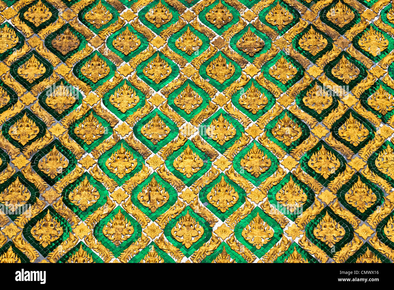 Native art carved on the wall in the temple Stock Photo - Alamy