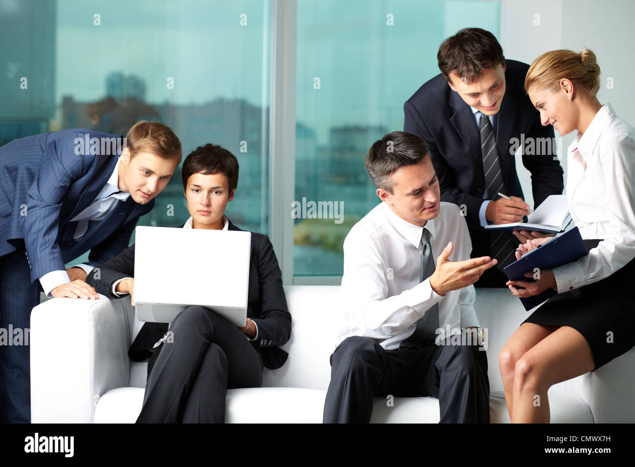 Five business people communicating in office Stock Photo - Alamy