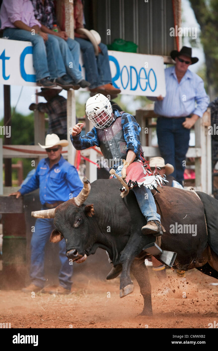 Bull rider in action at Mt Garnet Rodeo. Mt Garnet, Queensland ...