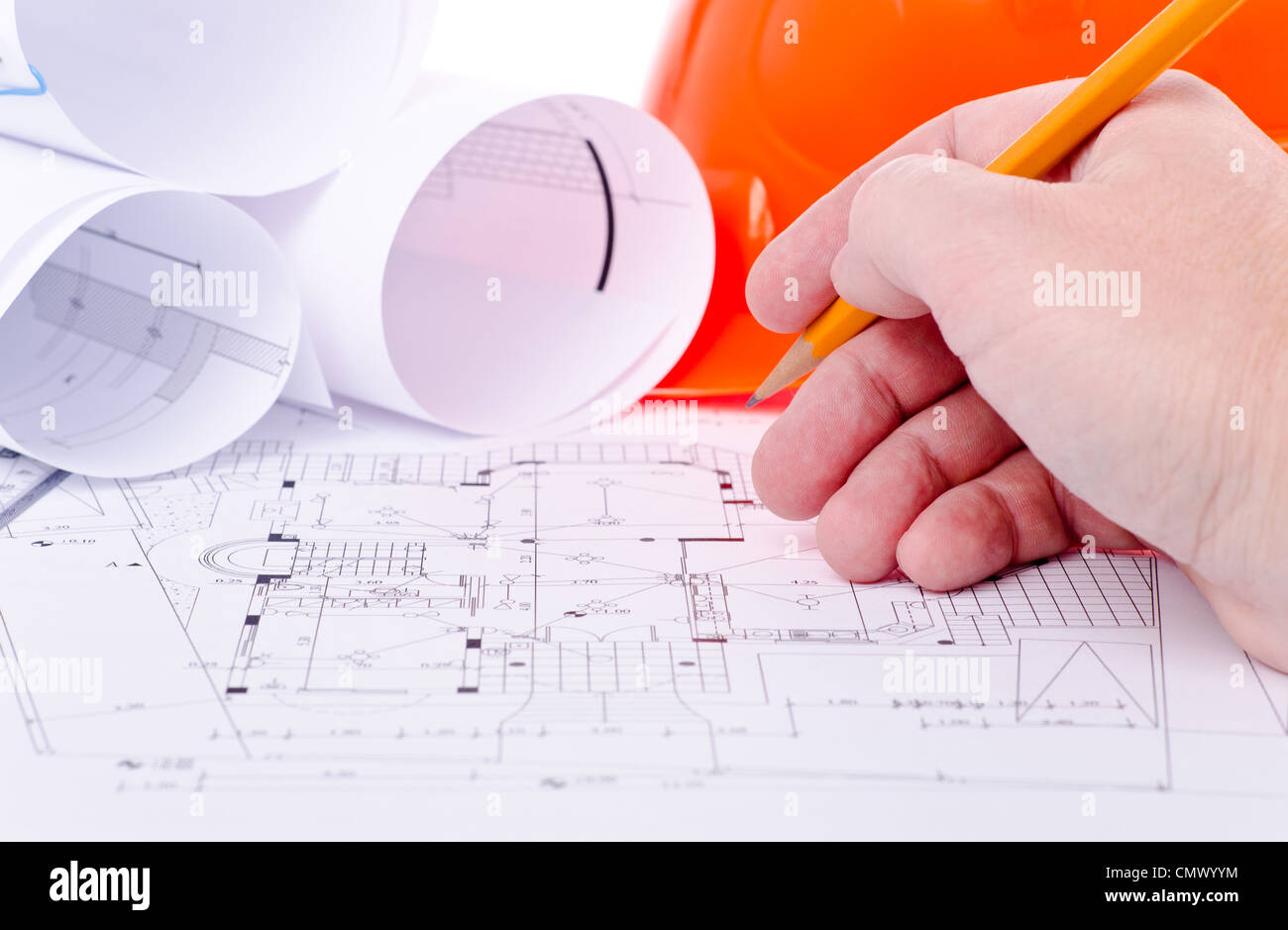Architect makes changes to the documentation on the construction site ...