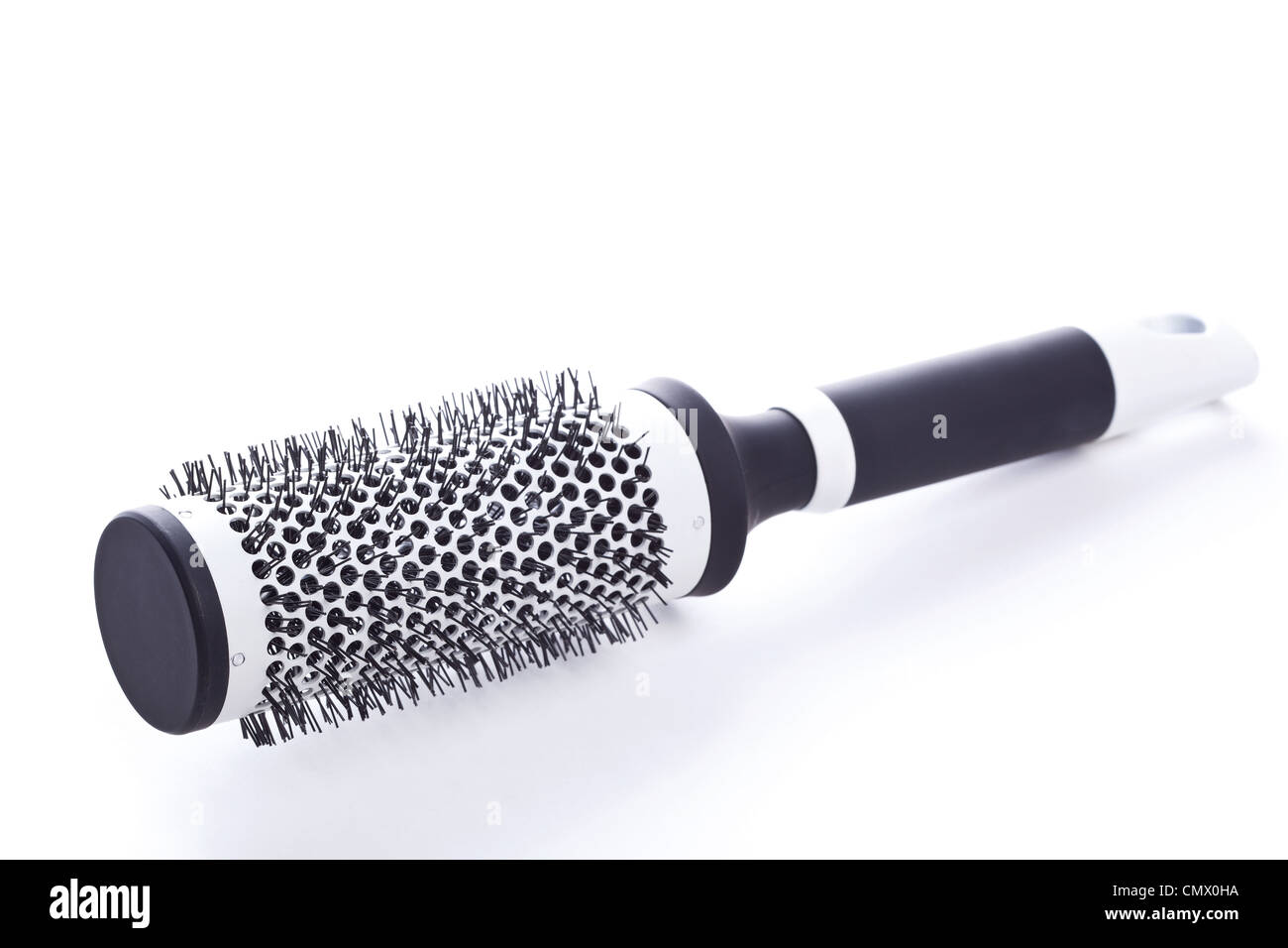 Round comb closeup on white background Stock Photo - Alamy