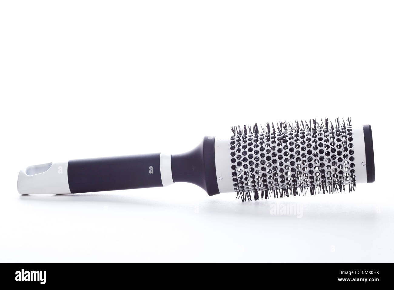 Round hairbrush closeup on white background Stock Photo - Alamy