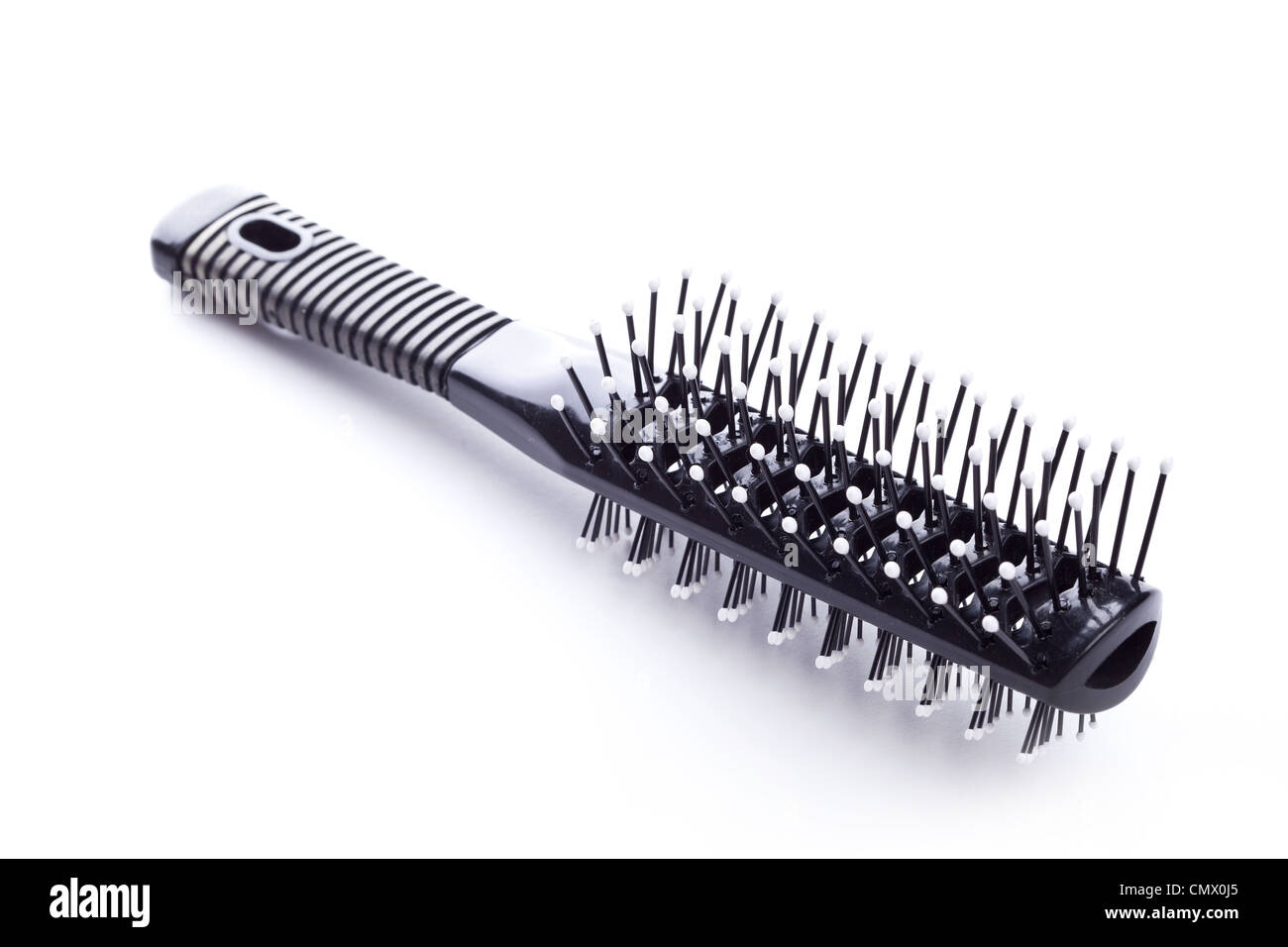 Black comb closeup on white background Stock Photo - Alamy