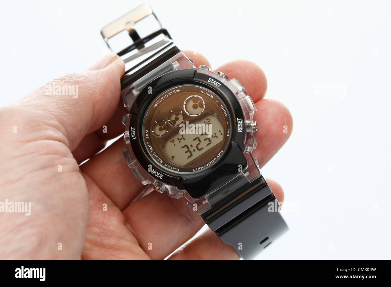 Human hand holding wrist watch, close up Stock Photo - Alamy