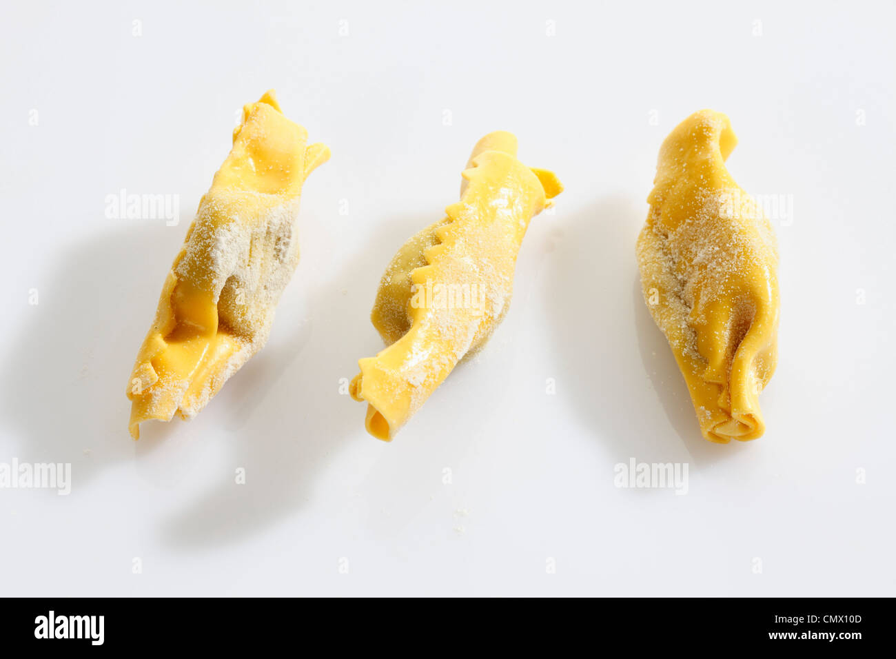 Candy shape pasta with riceflour on white background Stock Photo - Alamy