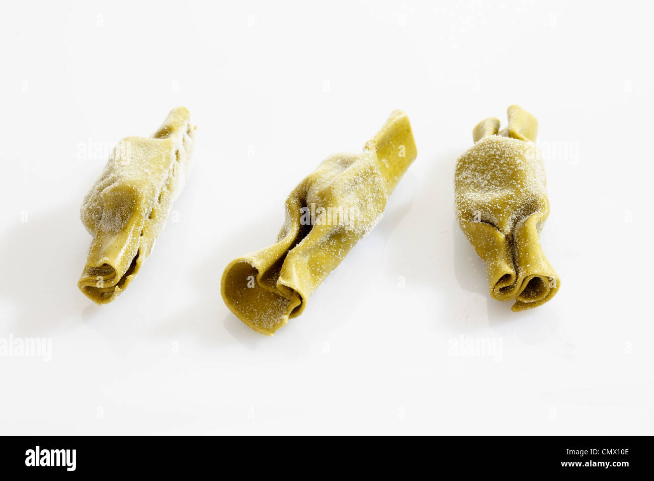 Candy shape pasta with riceflour on white background Stock Photo - Alamy
