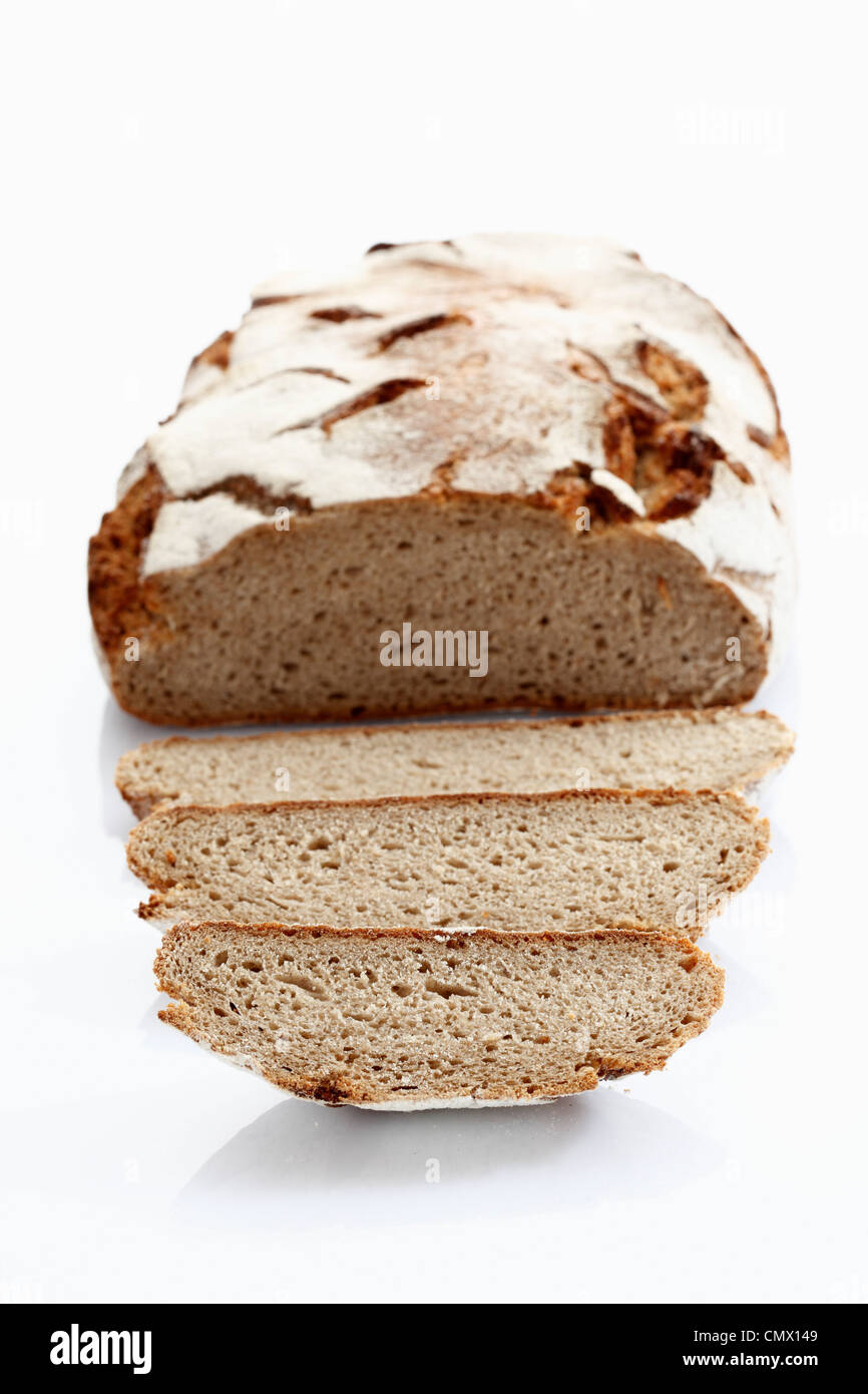 Rye bread loaf with slice on white background, close up Stock Photo - Alamy