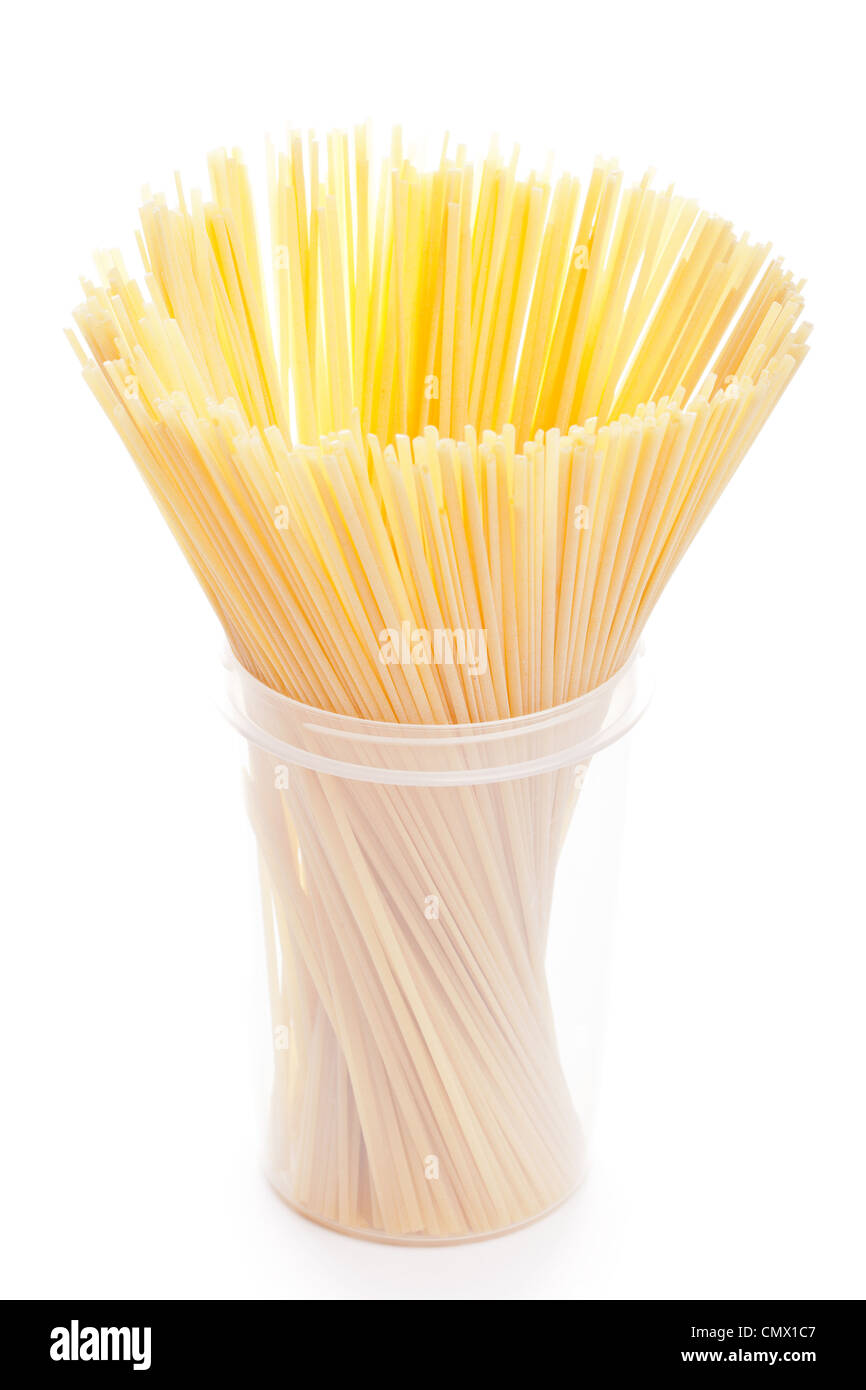 Bunch of spaghetti in plastic box isolated on white Stock Photo - Alamy