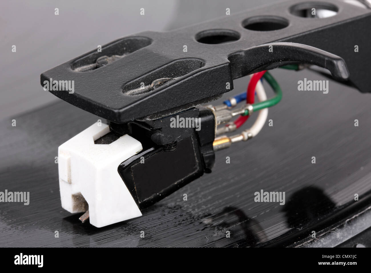 Dj needle on spinning record, closeup Stock Photo - Alamy