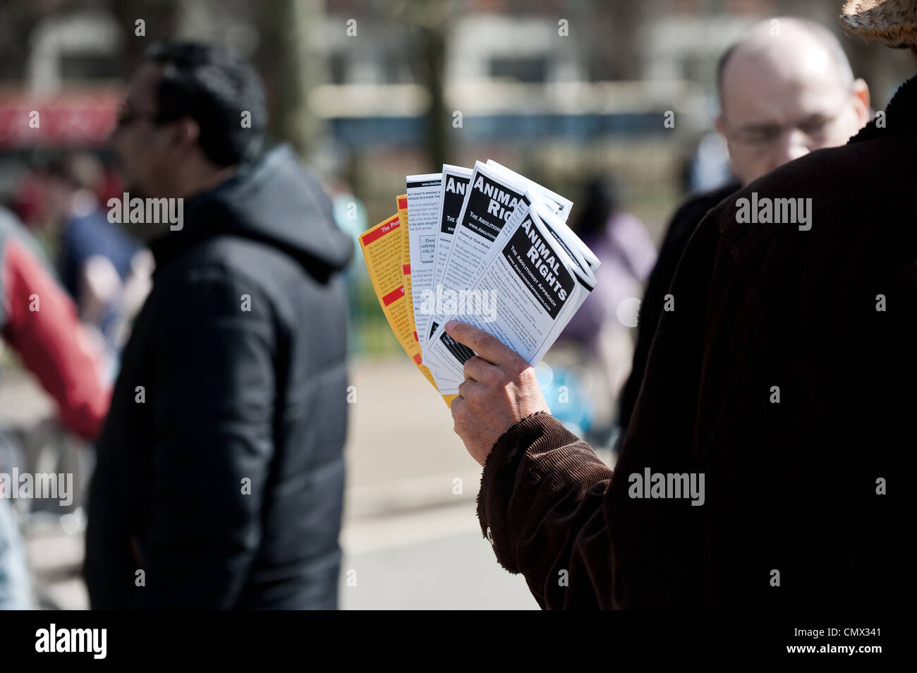 A man holding animal rights leaflets Stock Photo - Alamy