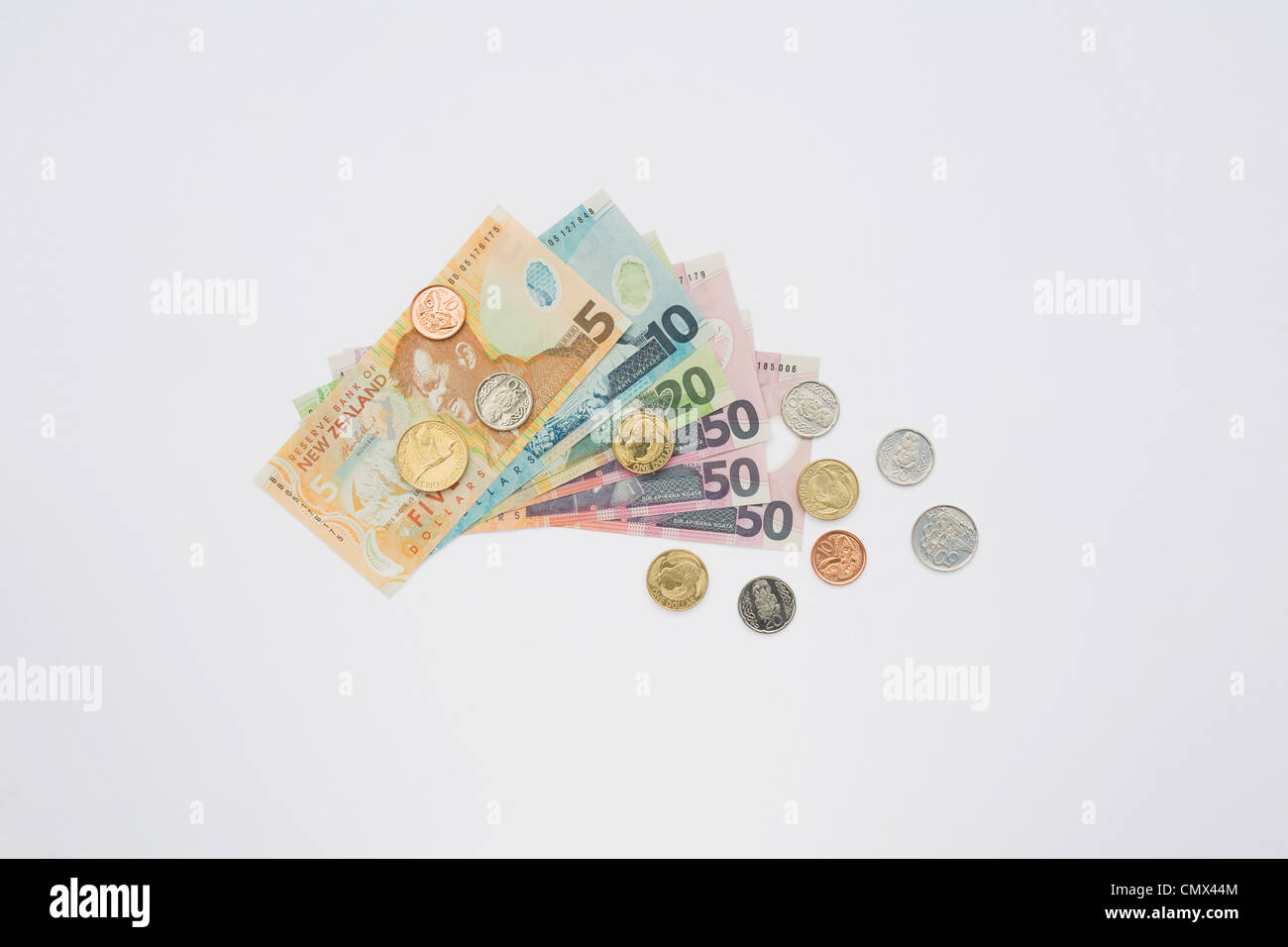 Notes and coins on white background Stock Photo - Alamy