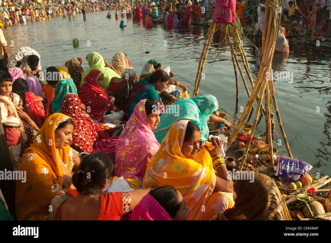 prayer offerings into Indian river Stock Photo - Alamy