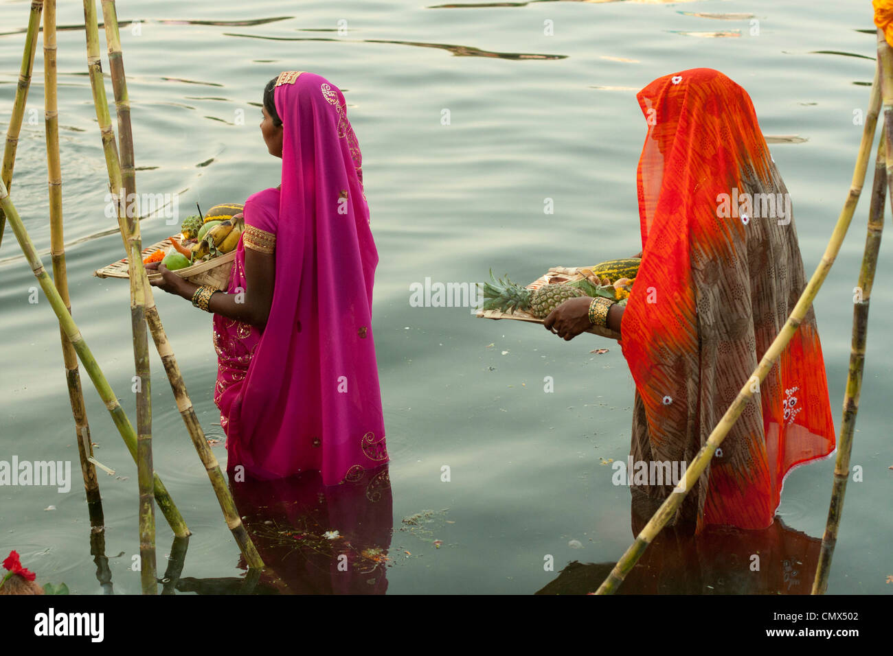 prayer offerings into Indian river Stock Photo - Alamy