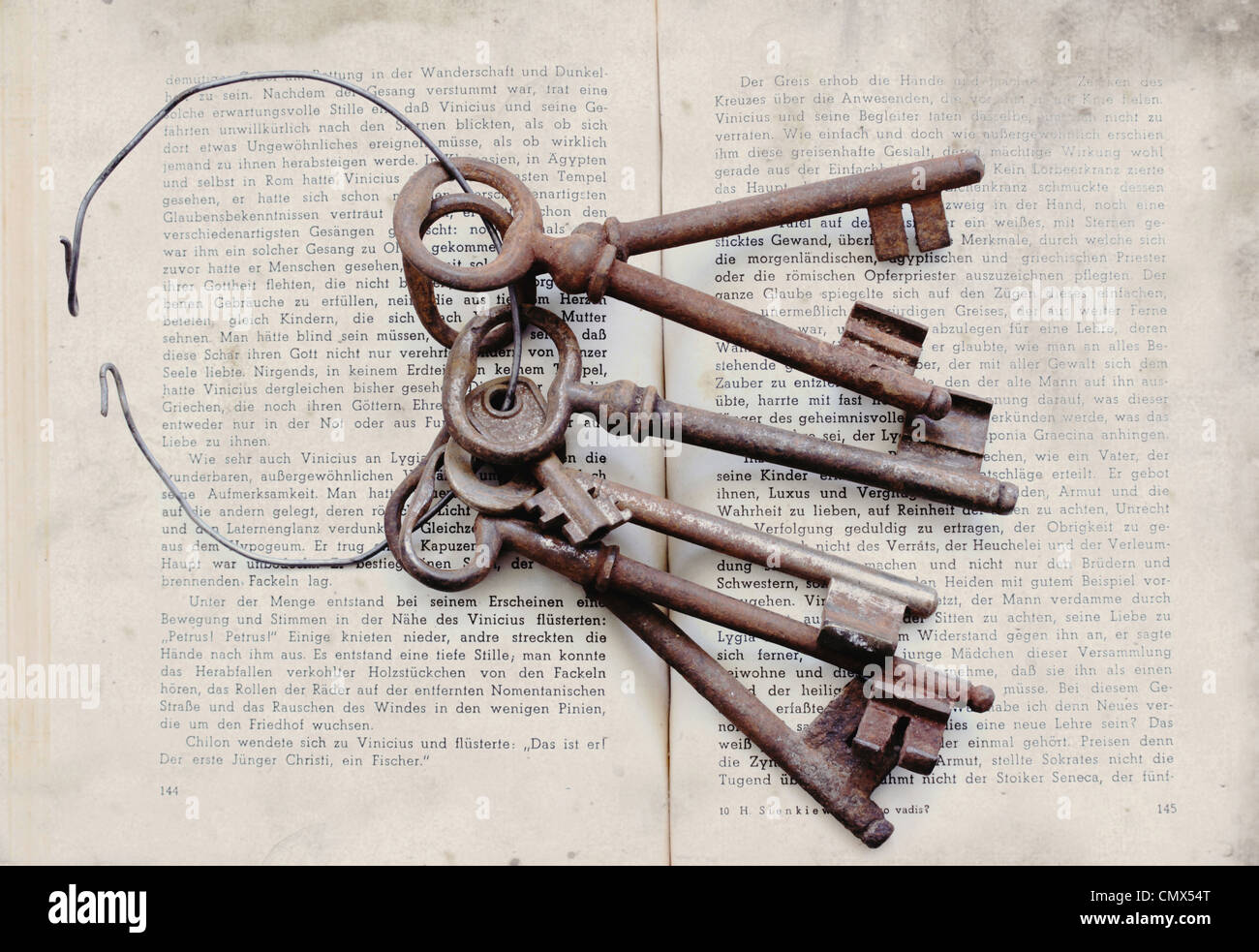 Bunch of keys on book Stock Photo - Alamy