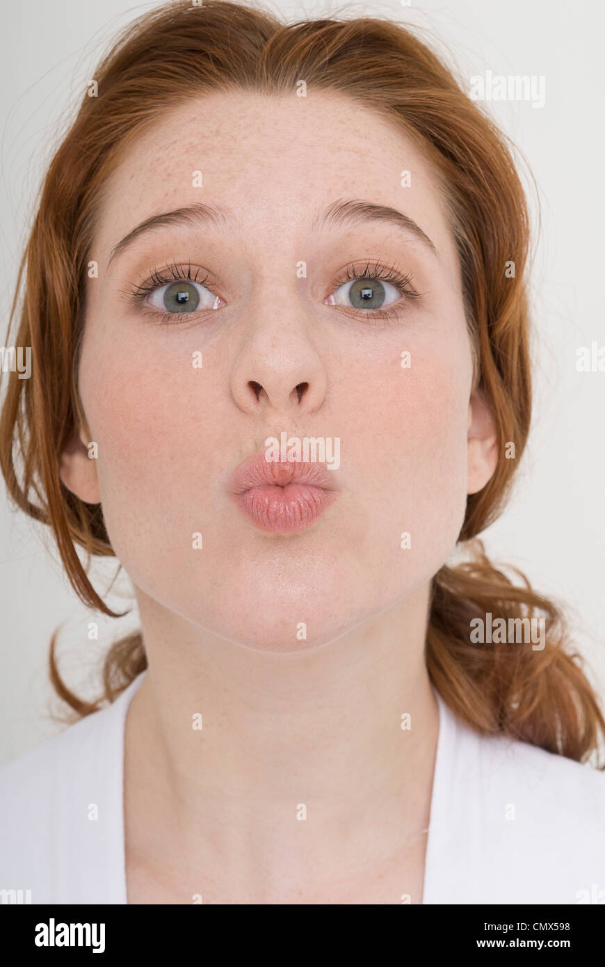 Young woman pouting, portrait Stock Photo - Alamy