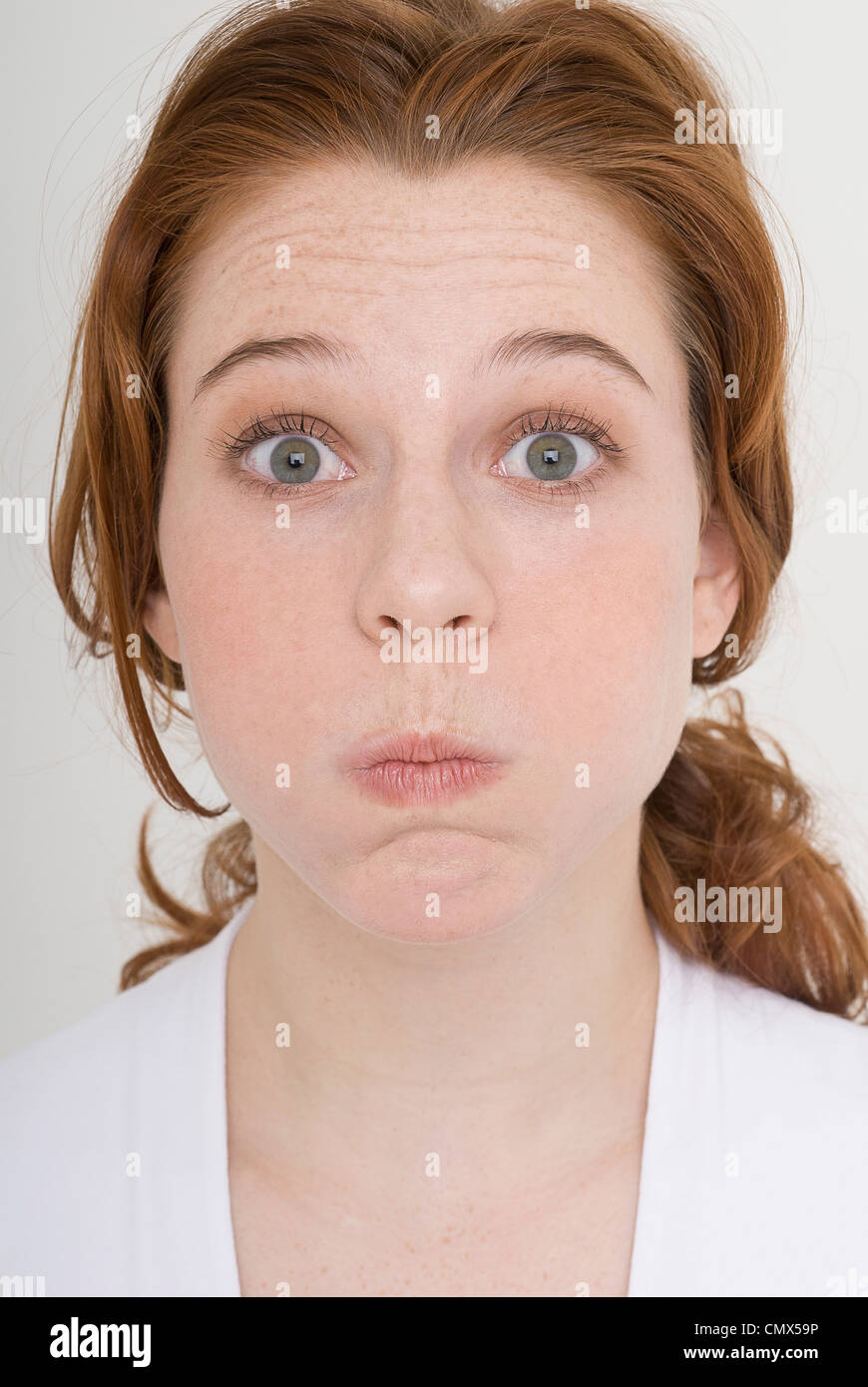 Young Woman Blowing Cheeks High Resolution Stock Photography and Images ...