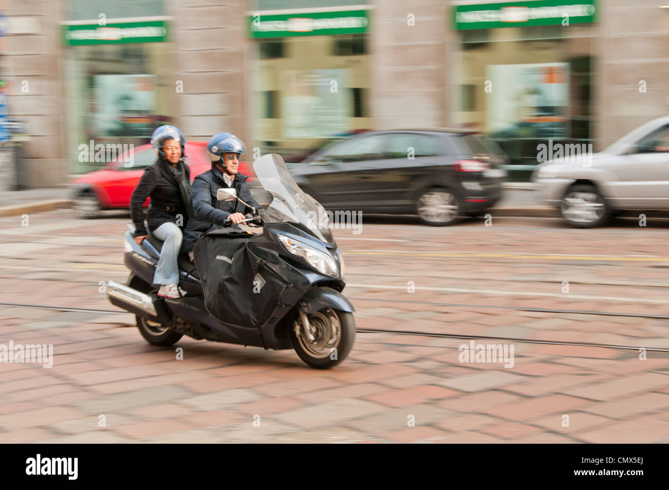 Moped /scooter rider in Milan Stock Photo - Alamy