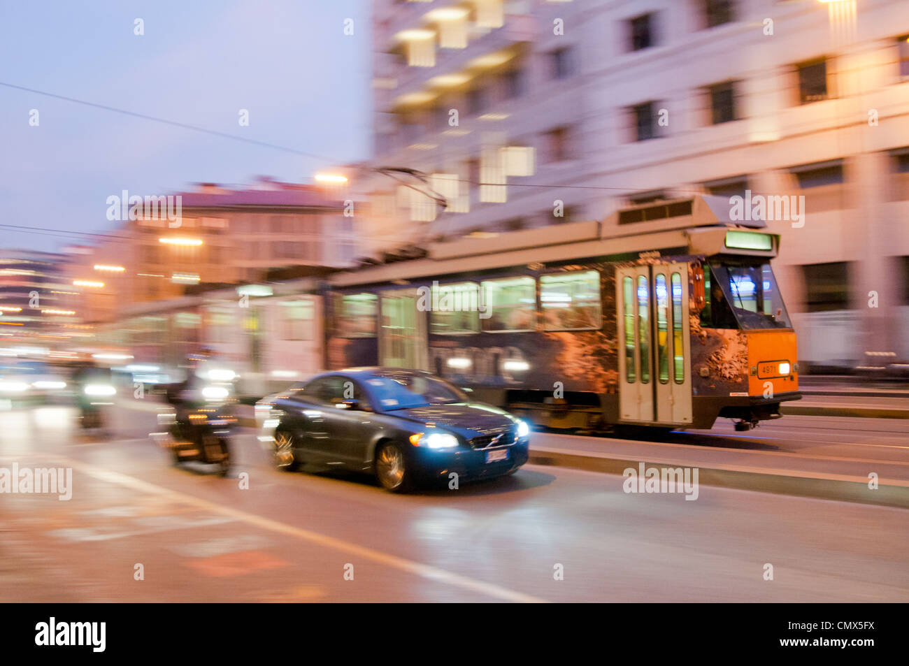 Rush hour traffic at night in Milan Stock Photo - Alamy