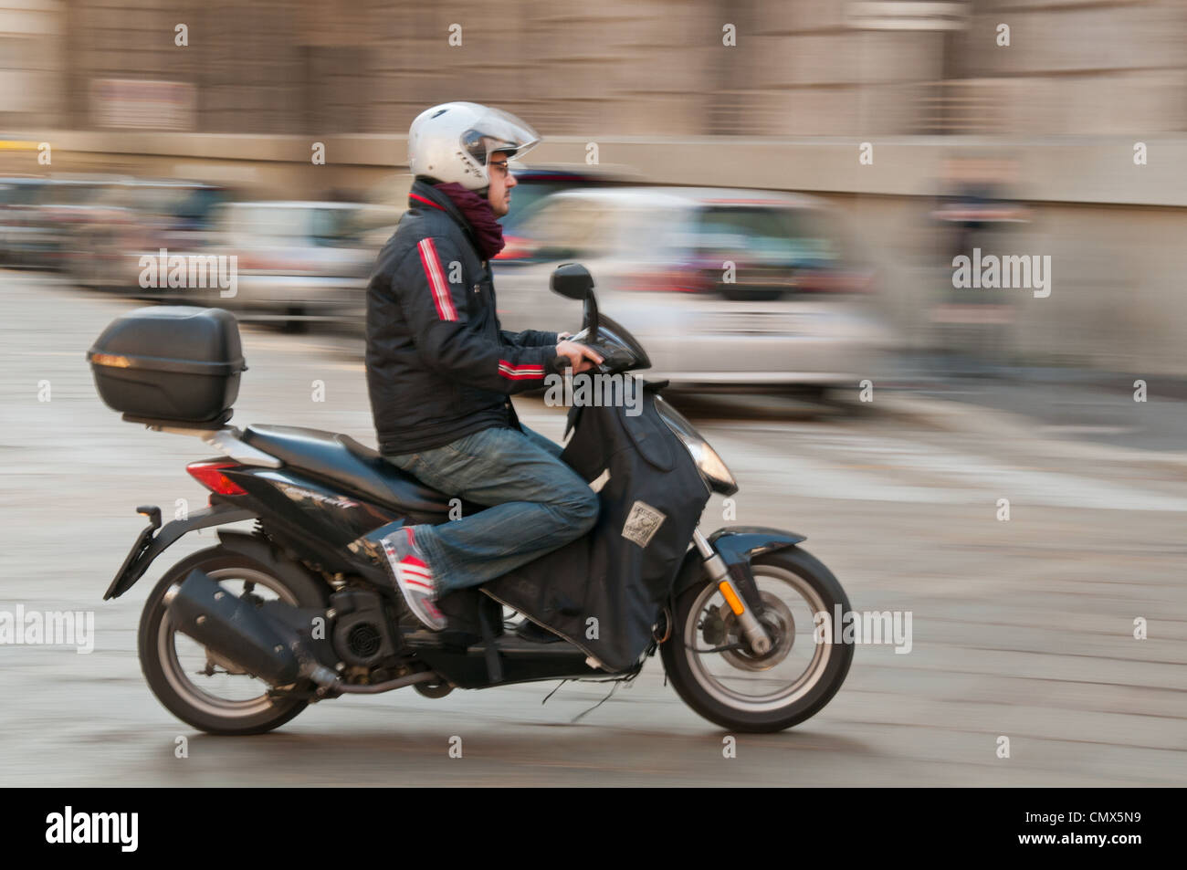Moped /scooter rider in Milan Stock Photo - Alamy