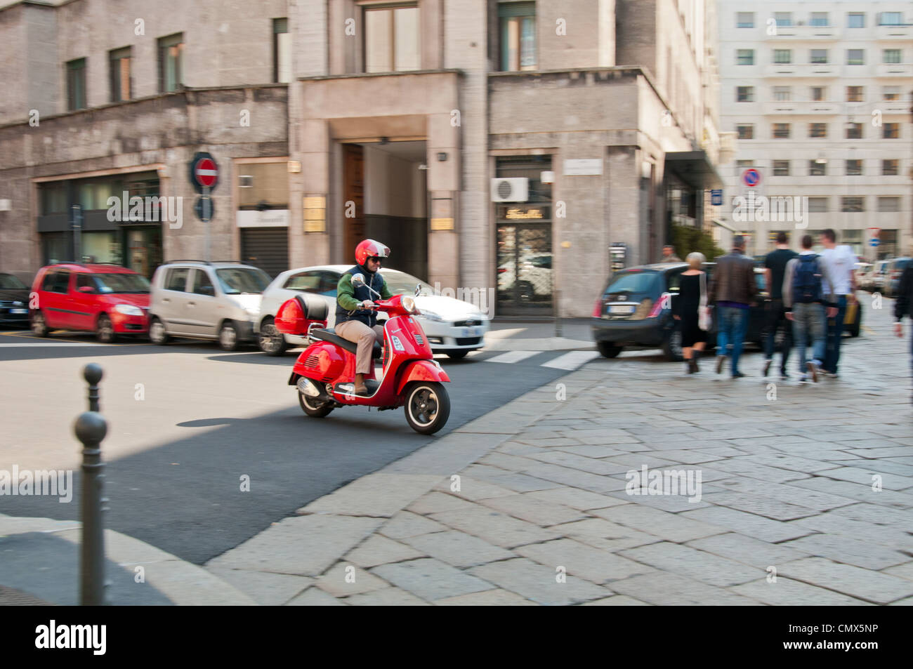 Moped /scooter rider in Milan Stock Photo - Alamy