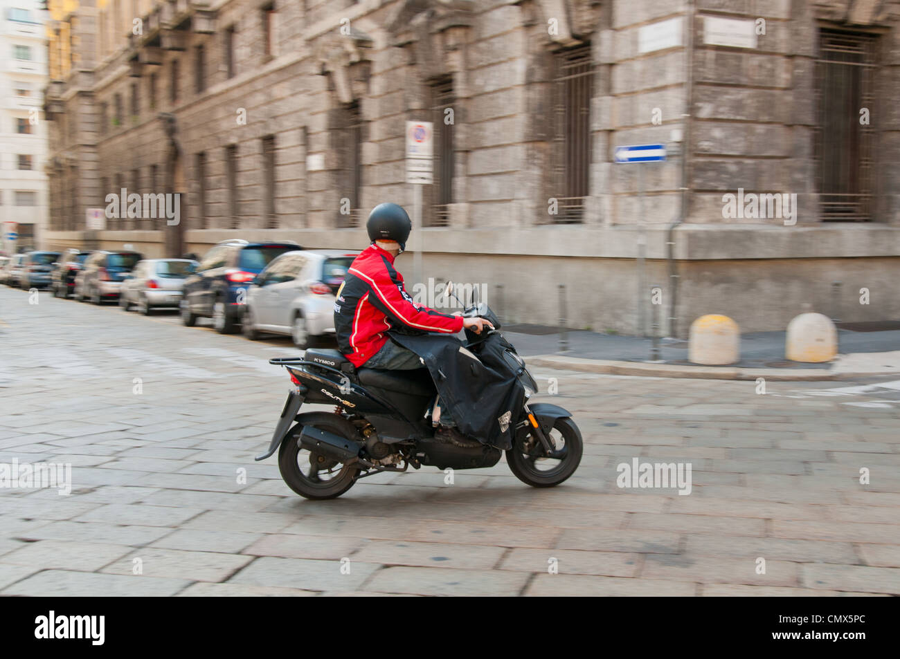 Moped /scooter rider in Milan Stock Photo - Alamy
