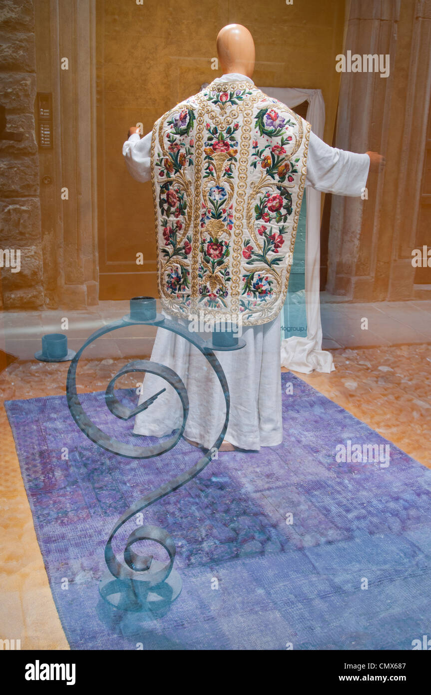 Italian Ecclesiastical gowns / robes in a makers shop window Stock ...