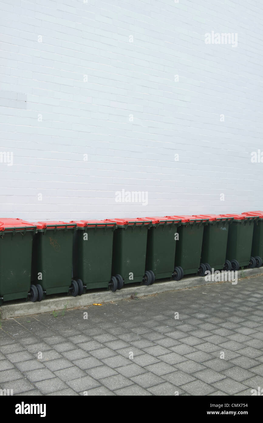 A row of wheelie rubbish bins Stock Photo - Alamy
