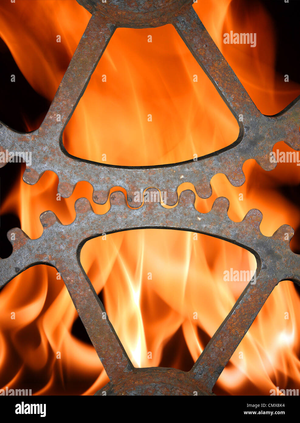 Rusty cogs against a background of flames Stock Photo - Alamy
