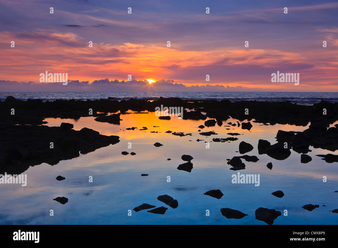 Ocean and lava rocks at sunset hi-res stock photography and images - Alamy