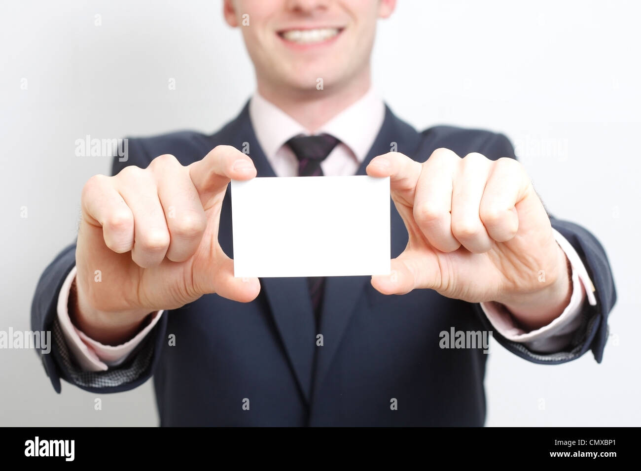 A business man presenting his business card Stock Photo - Alamy