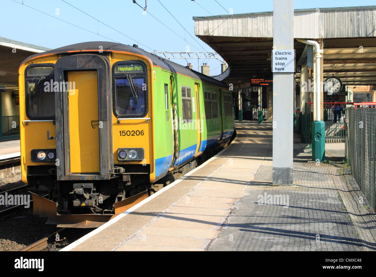 Diesel multiple unit train leaving Carnforth station with a service to ...