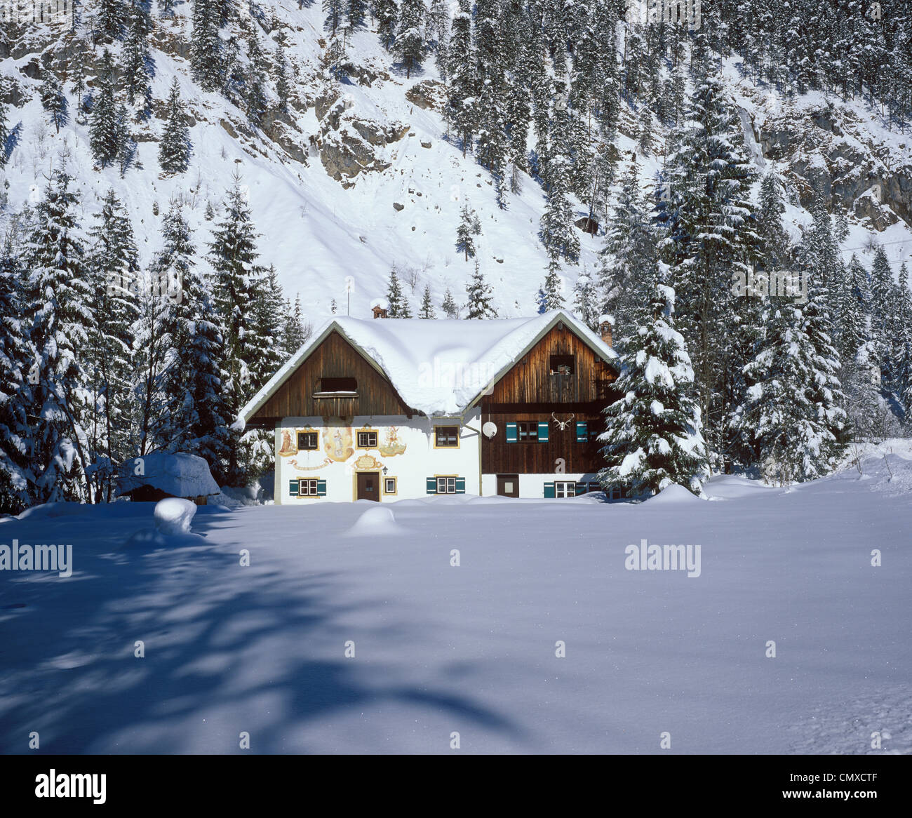 Germany, Bavaria, Upper Bavaria, View of mill house in snow Stock Photo ...
