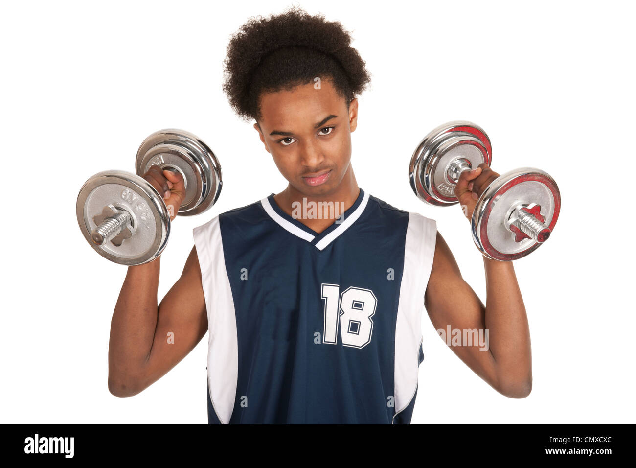 Young black boy is doing workout with dumbbells Stock Photo - Alamy