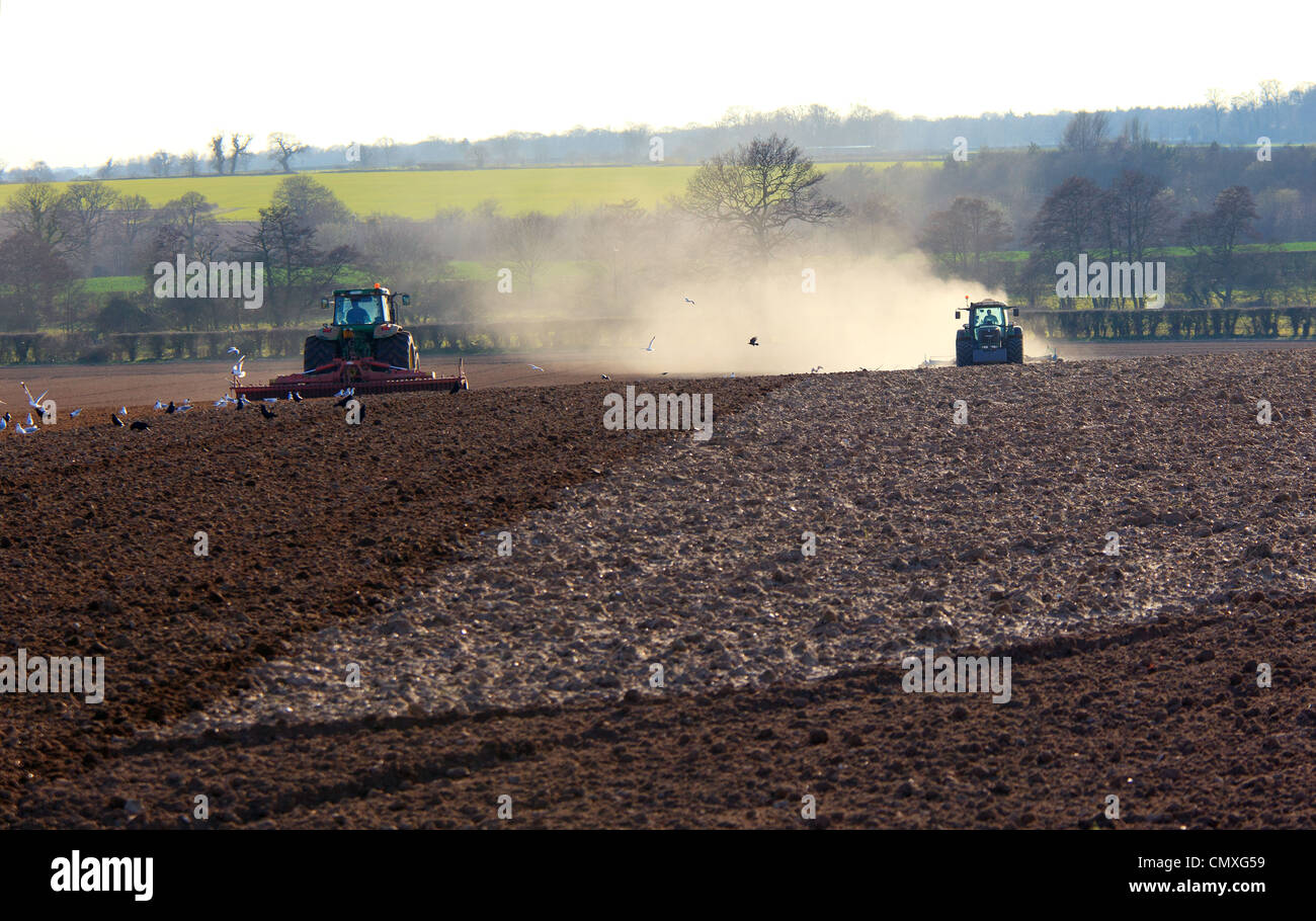 Farmers preparing a dry field under almost drought conditions for ...