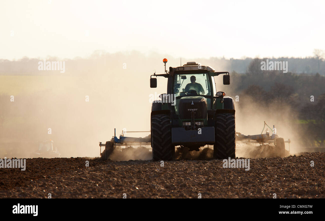 Farmers preparing a dry field under almost drought conditions for ...