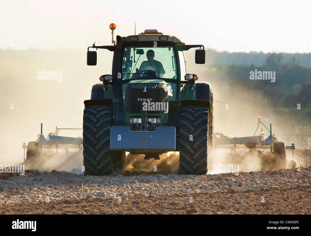 Farmers preparing a dry field under almost drought conditions for ...