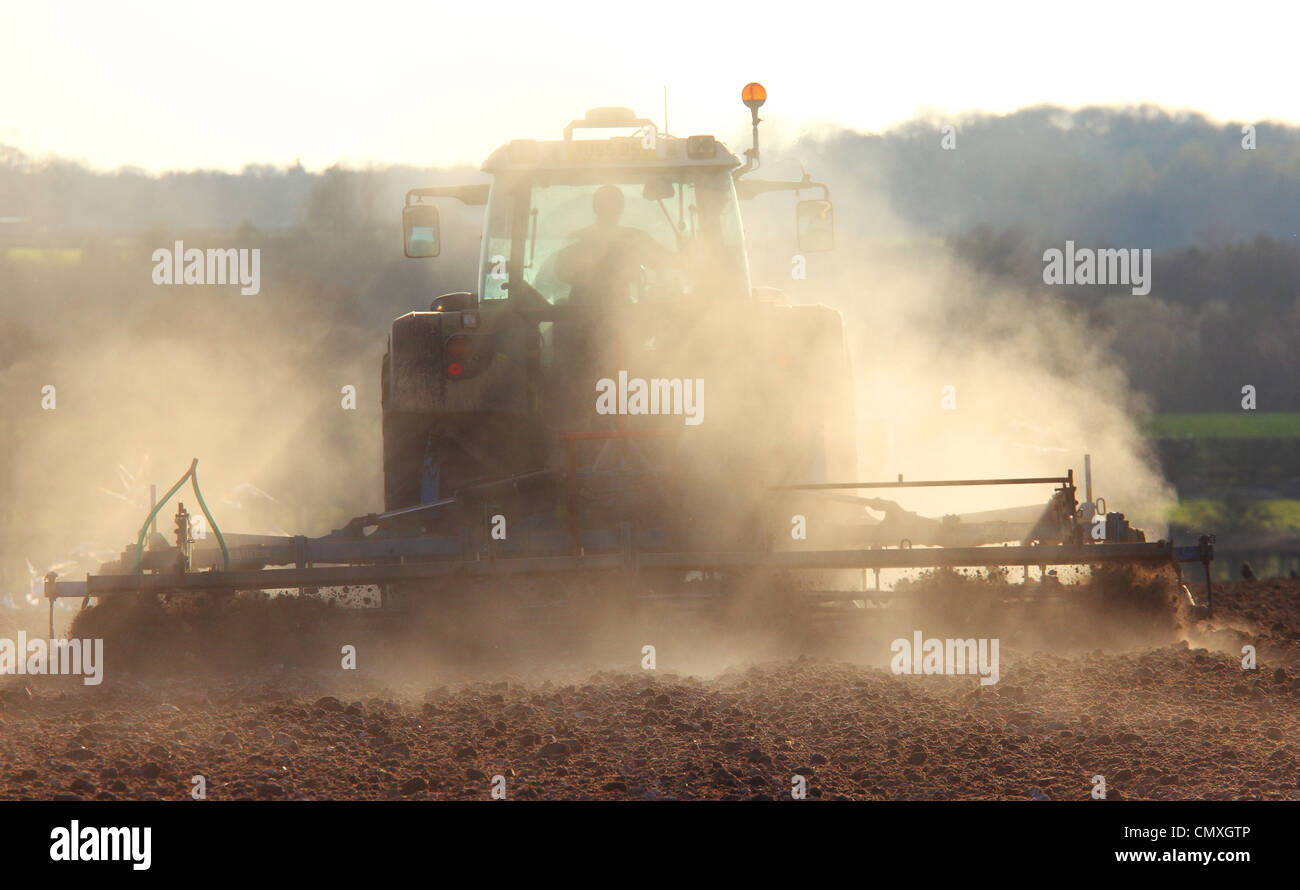 Farmers preparing a dry field under almost drought conditions for ...