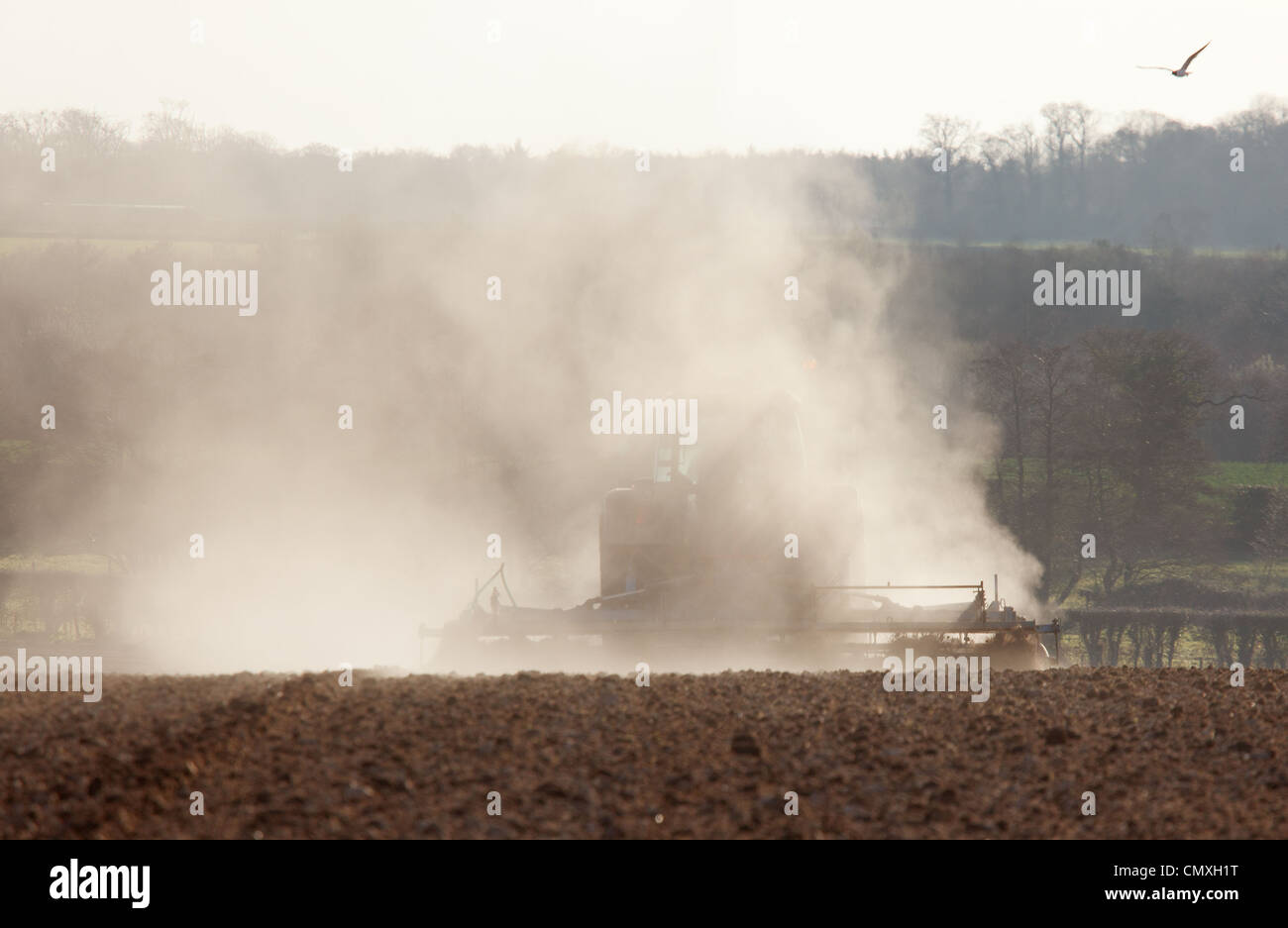 Farmers preparing a dry field under almost drought conditions for ...