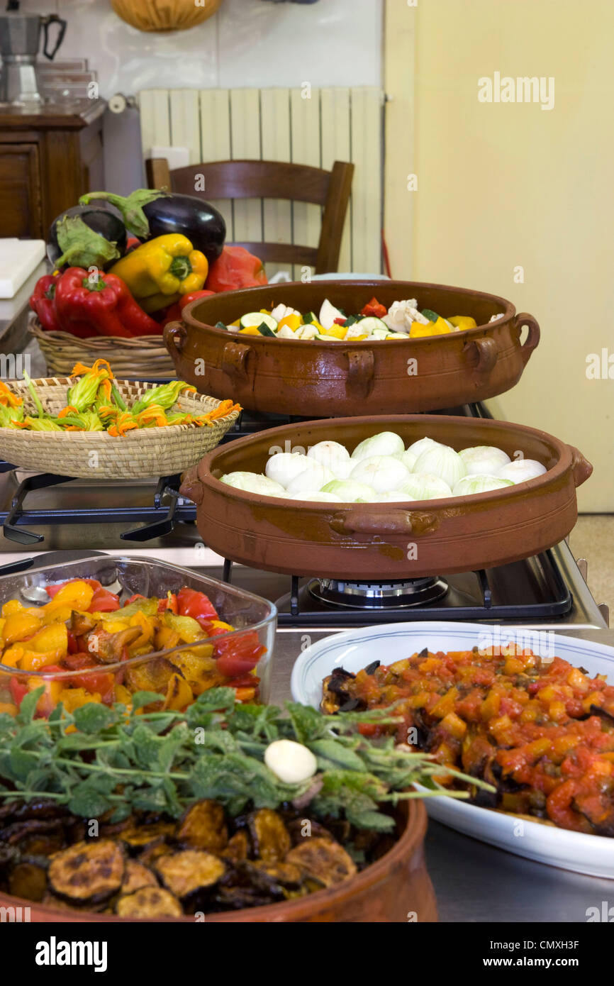 Making of vegetarian food in earthenware container Stock Photo - Alamy
