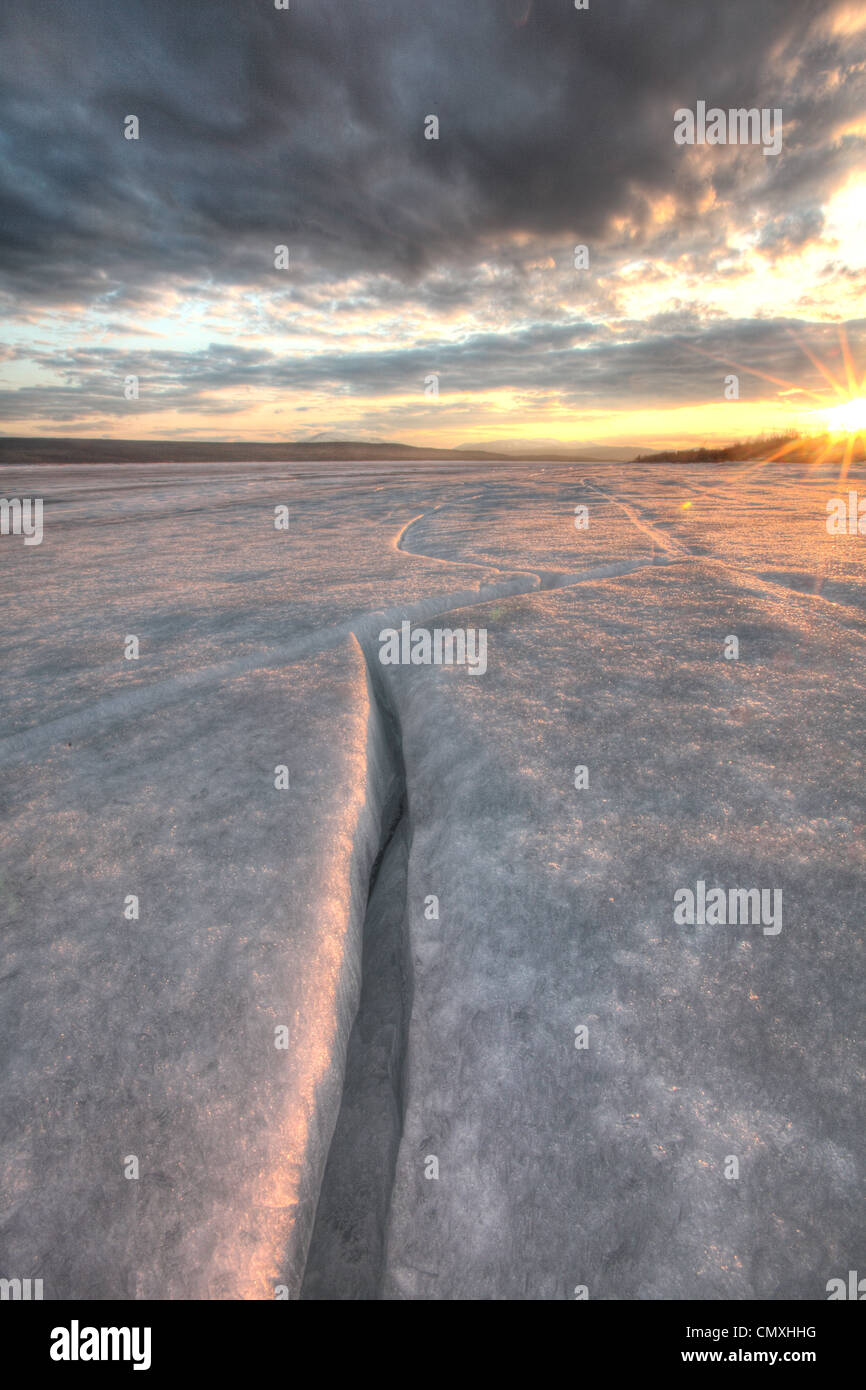 Setting sun on the ice of Teslin Lake, Yukon Stock Photo - Alamy