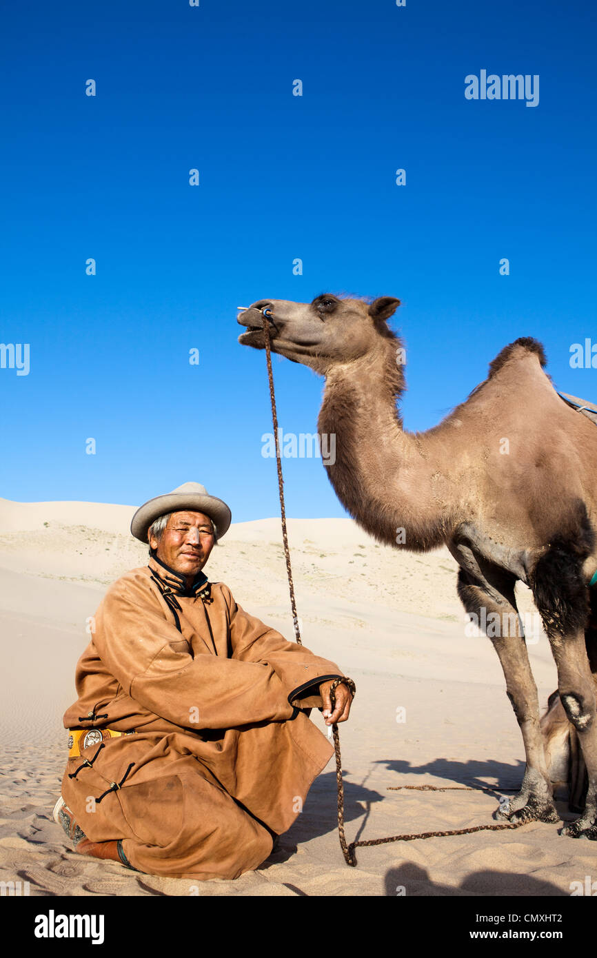 Camel owner take pose in Gobi desert, Khongor sand dune, Mongolia Stock ...