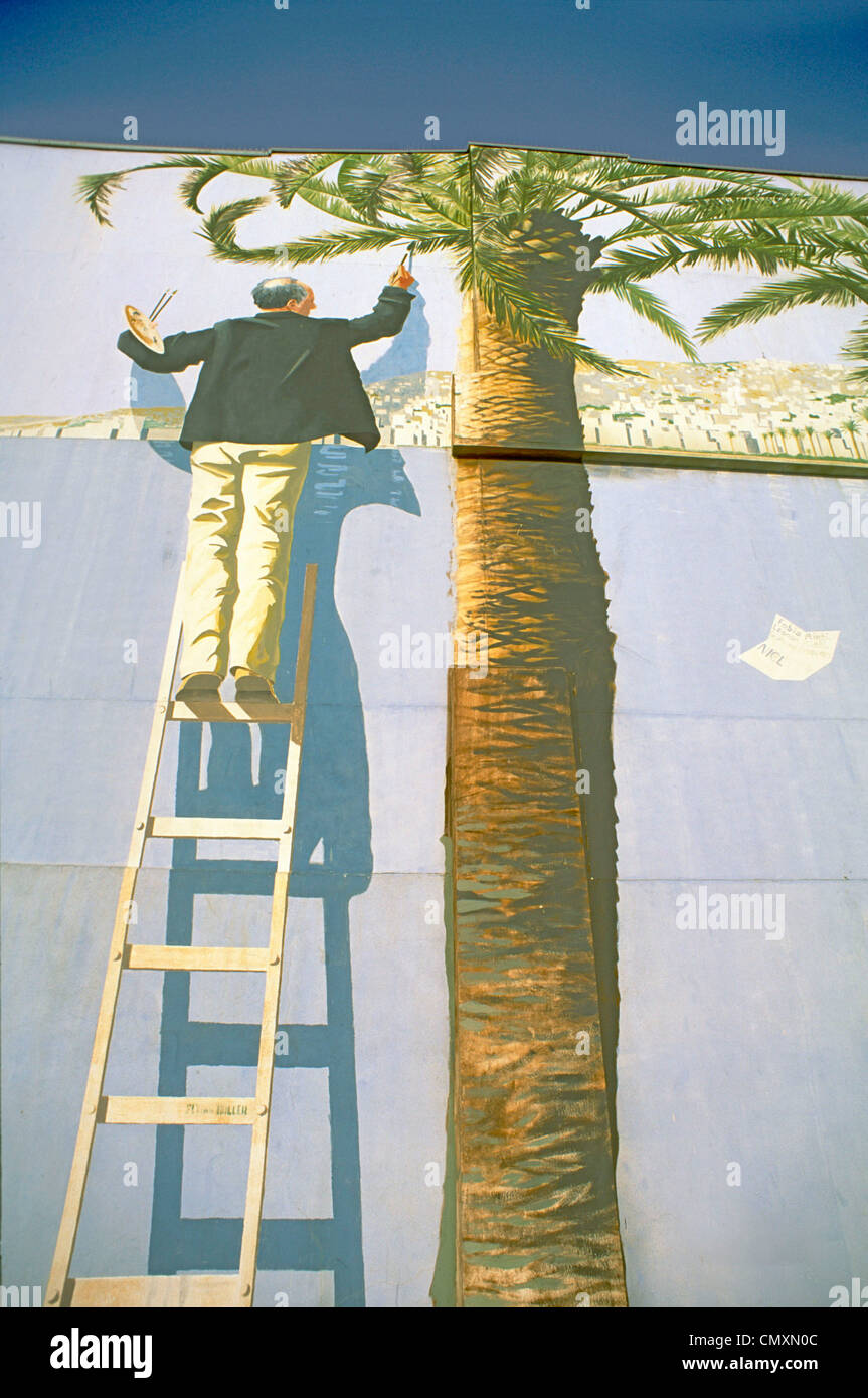 Man painting palm tree standing on ladder, Art, Nice, France Stock ...